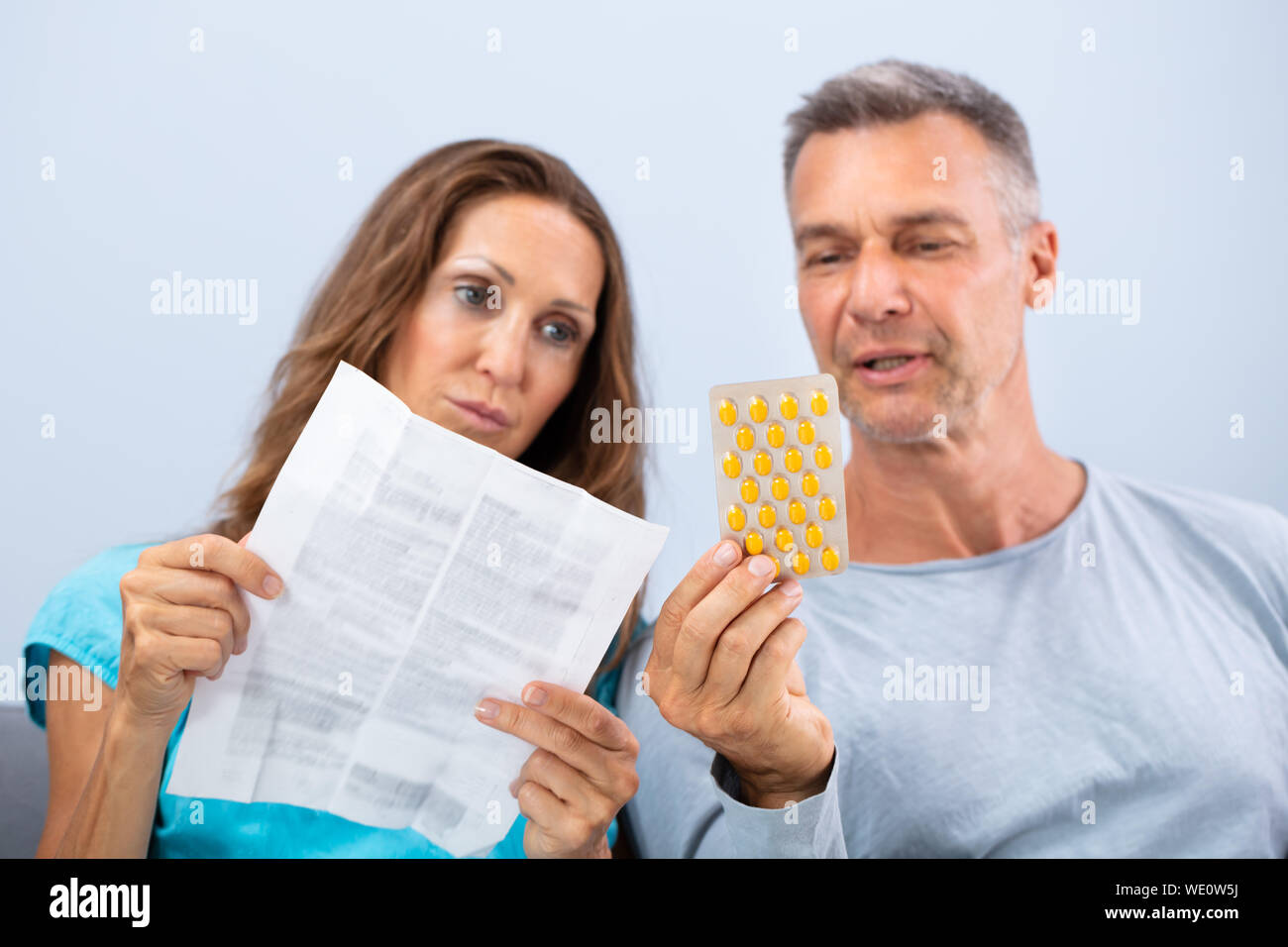 Older man reading leaflet hi-res stock photography and images - Alamy