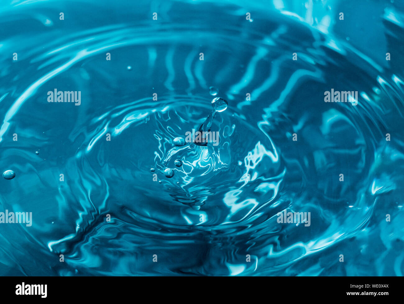 Drop of water. Blue water drop. Falling water. Water splash close-up ...