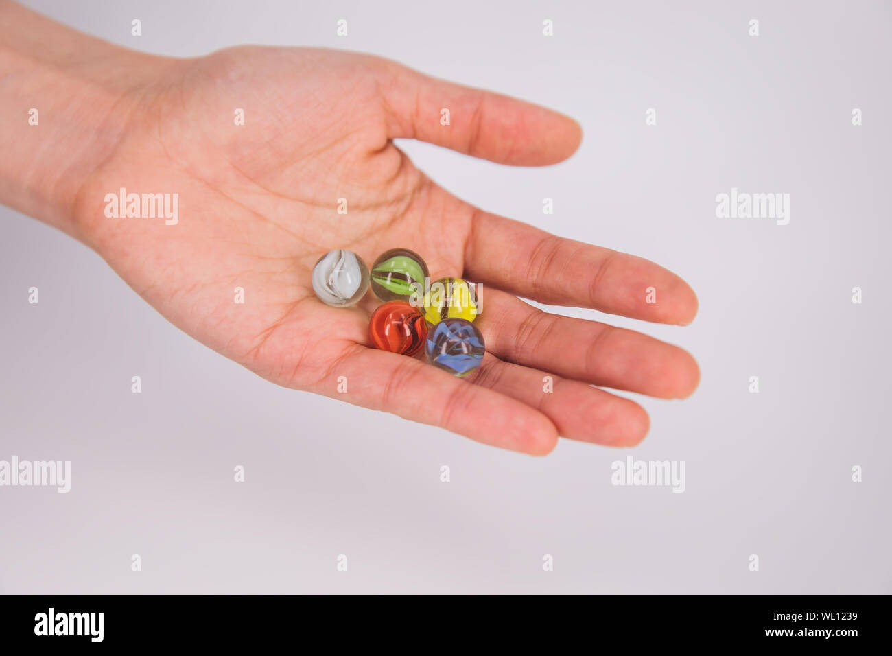 Hand Holding Marbles High Resolution Stock Photography and Images - Alamy