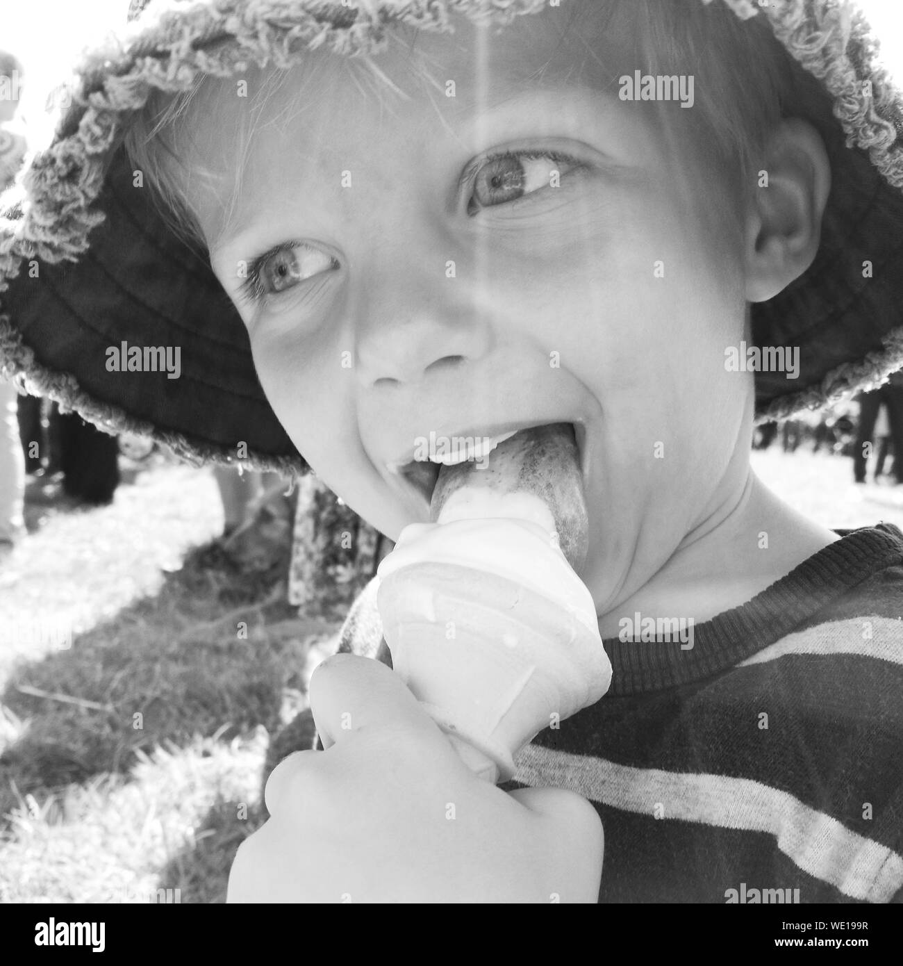 Boy eating ice cream Black and White Stock Photos & Images - Alamy