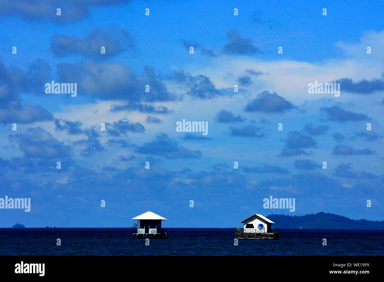 Blue floating house hi-res stock photography and images - Alamy