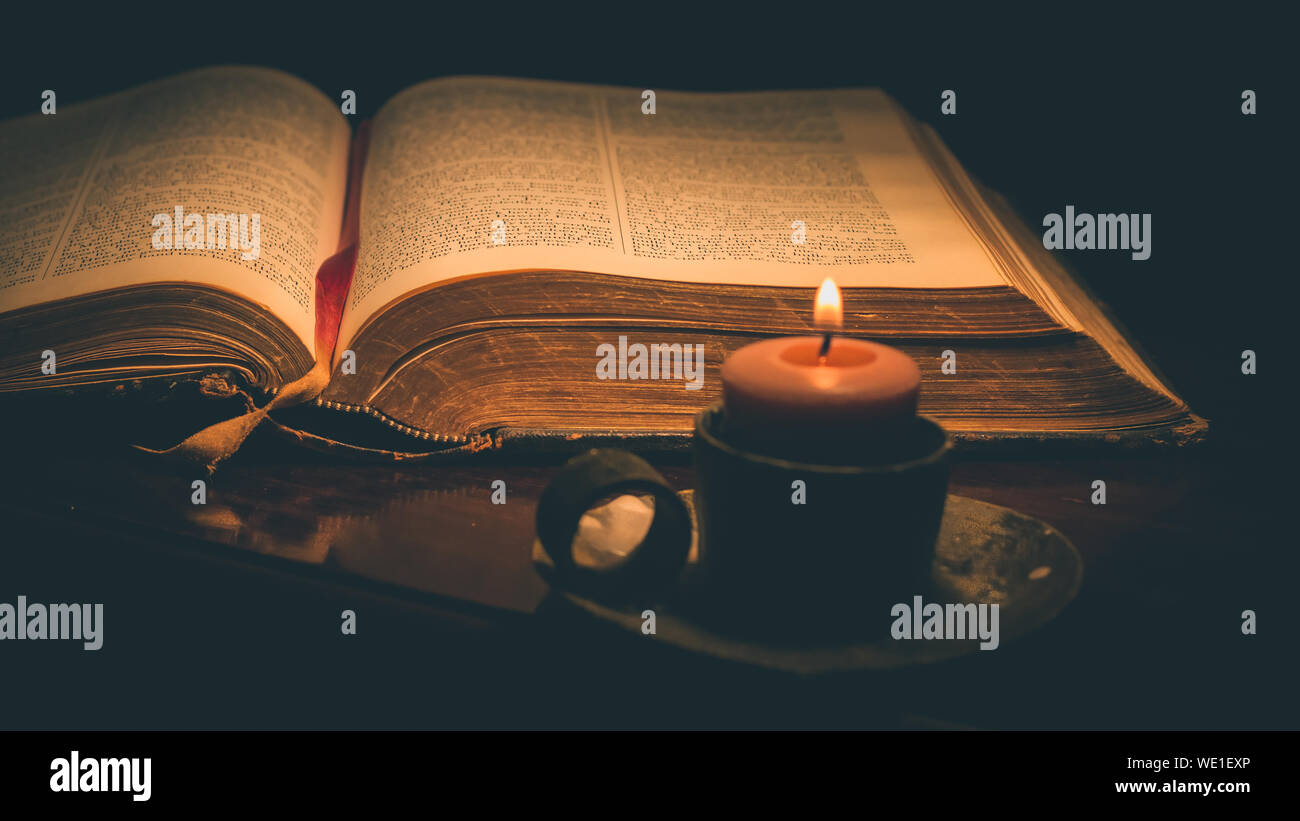 Open Bible And Candle High Resolution Stock Photography and Images - Alamy