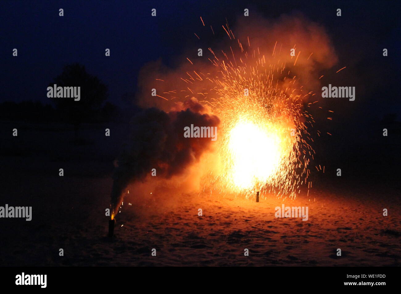 Firework Exploding On Sand At Beach Stock Photo - Alamy