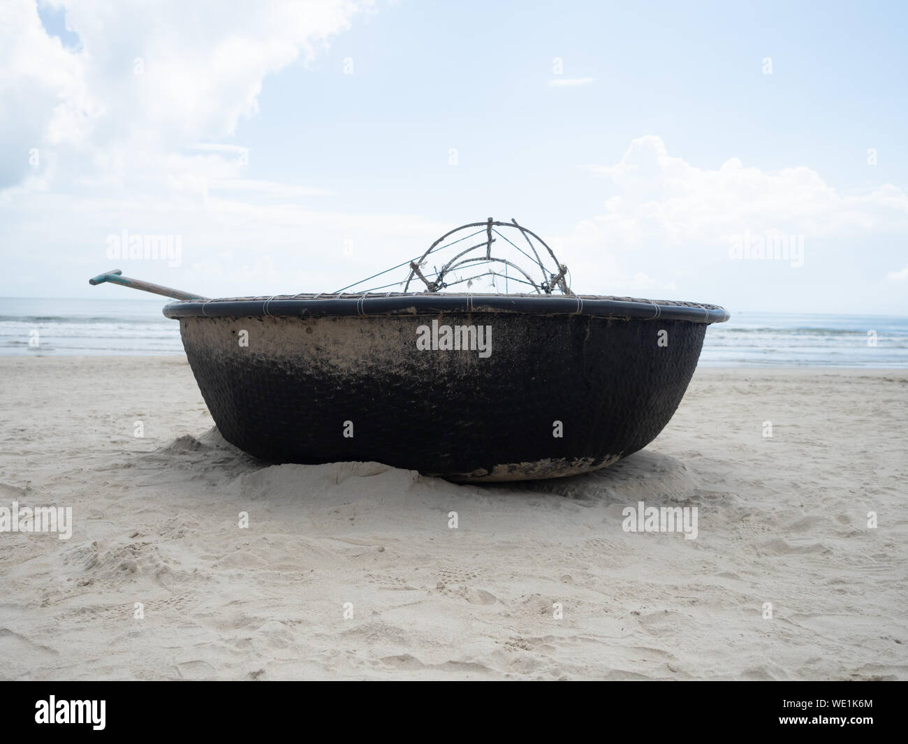 Iconic Vietnamese basket boat for fishing on a sandy beach in Danang ...
