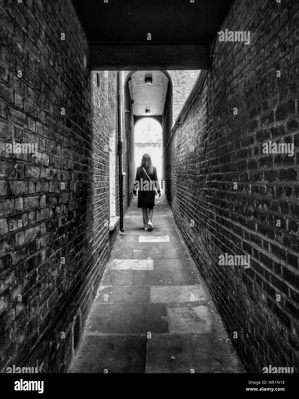 Woman alley way rear hi-res stock photography and images - Alamy