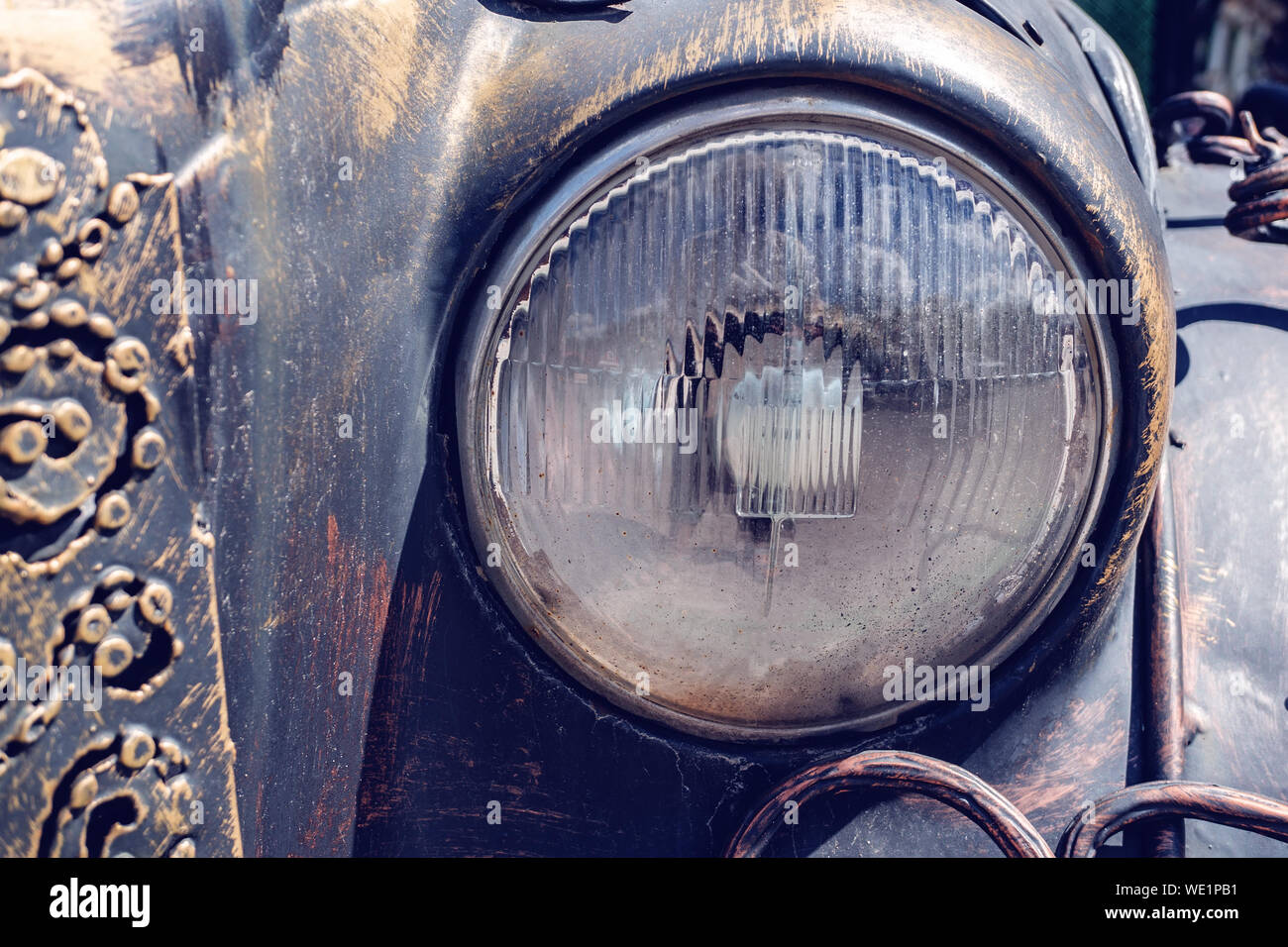 Gold metal vintage textured background with old glass round headlight ...