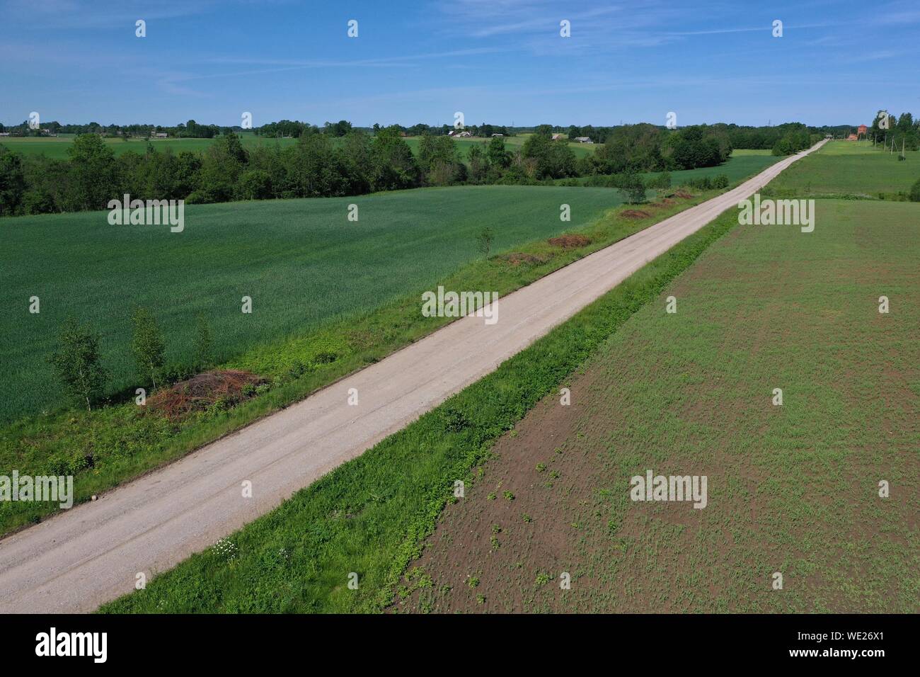 Aerial view of gravel road on farmland fields in spring Stock Photo - Alamy