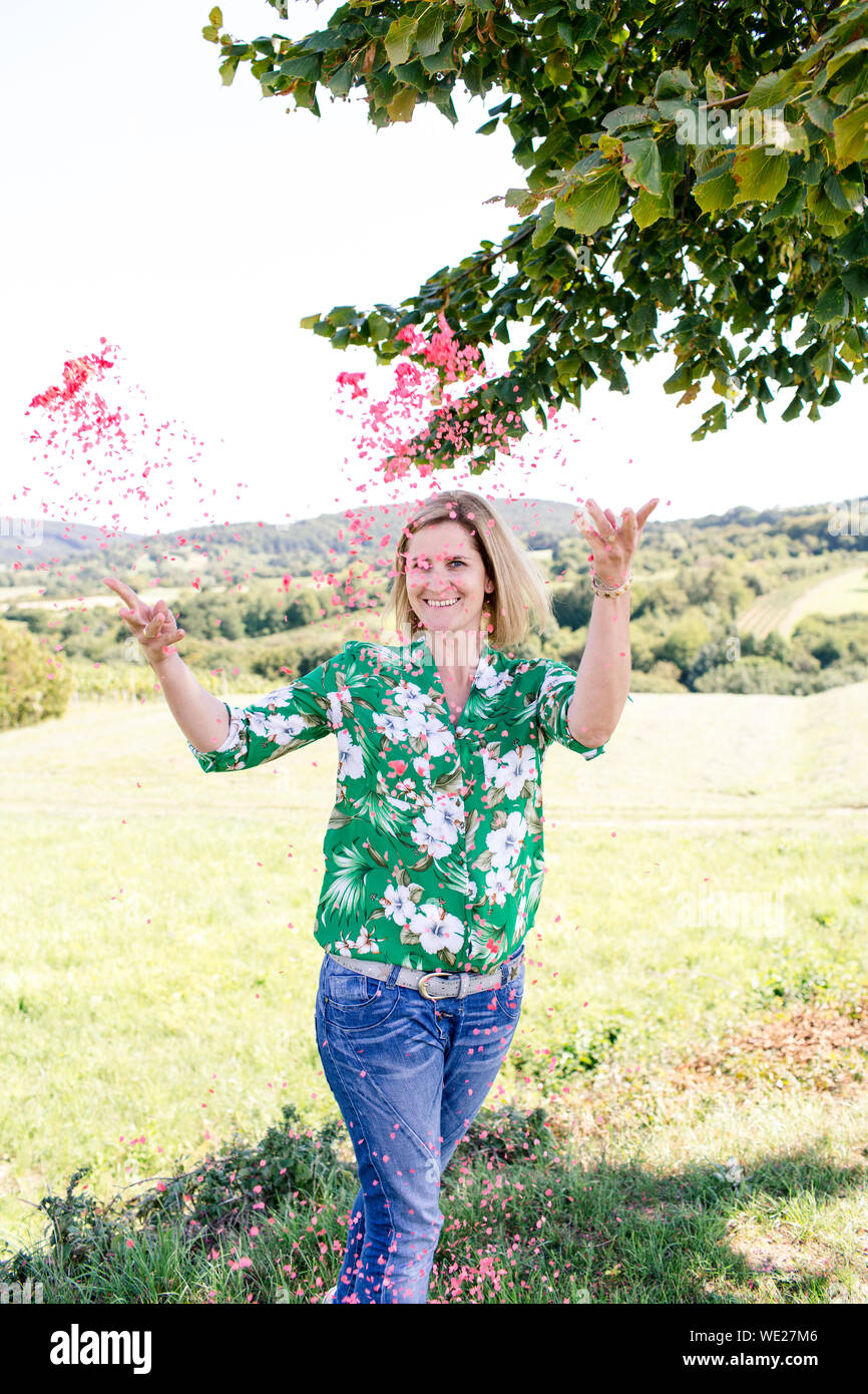 Woman Throwing Petals High Resolution Stock Photography and Images - Alamy