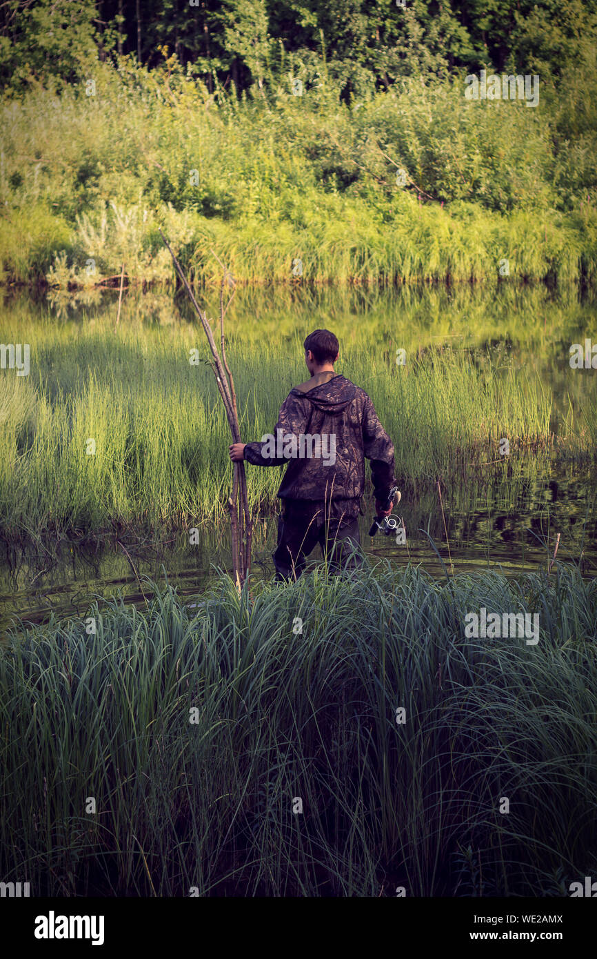 Man wading into water hi-res stock photography and images - Alamy