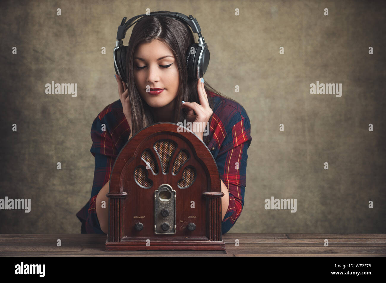 Woman is listening radio hi-res stock photography and images - Alamy