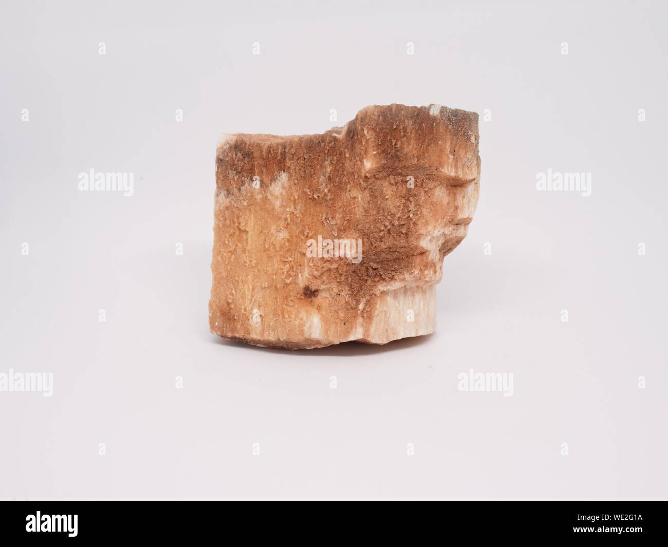 Rough mineral stone red gypsum on white background close up. Raw ...