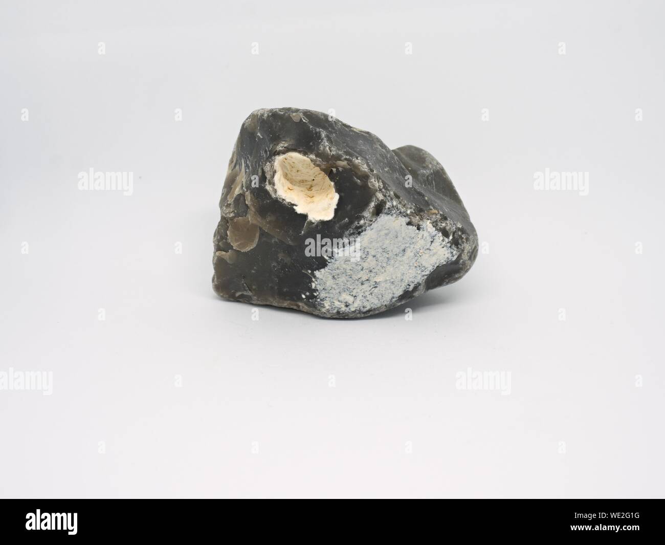 Sharp broken basalt stone with some cavity inside, isolated on white ...