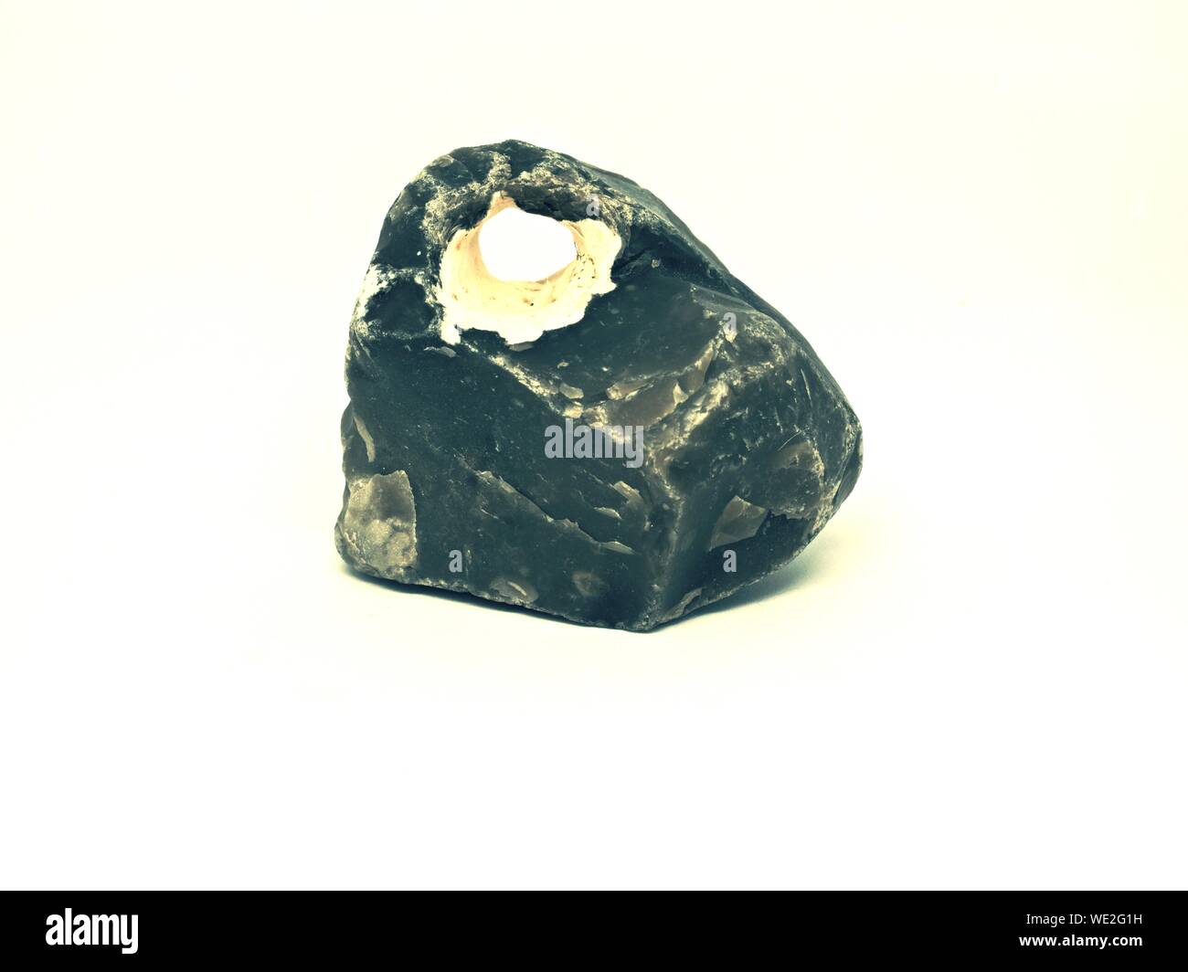 Broken stone with hole or cavity, the rock isolated on white background ...