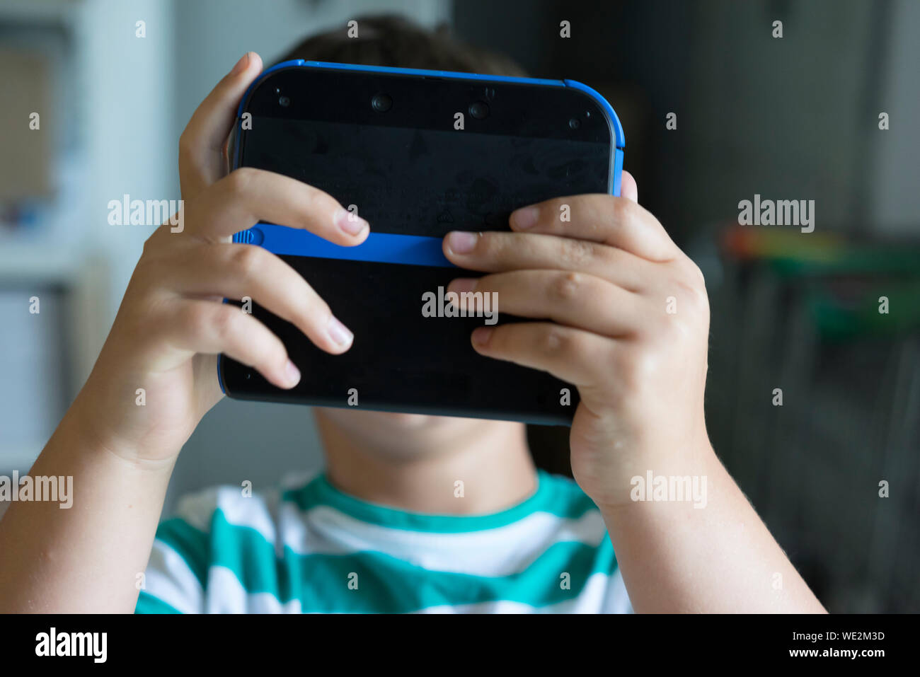 Holding video game in front of his face hi-res stock photography and ...