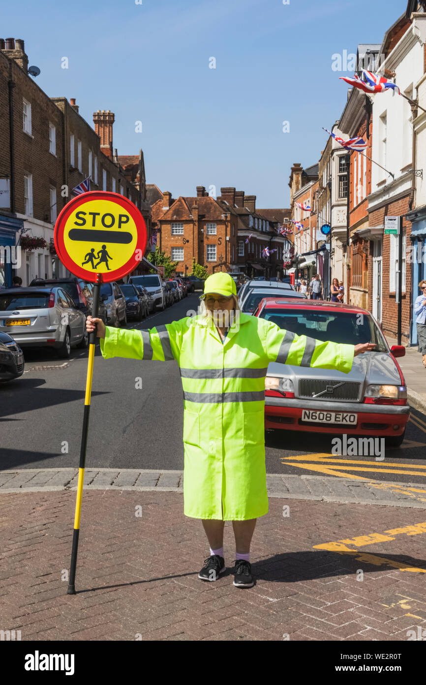 England, Berkshire, Eton, Eton High Street, Lollipop Lady Holding Stop ...