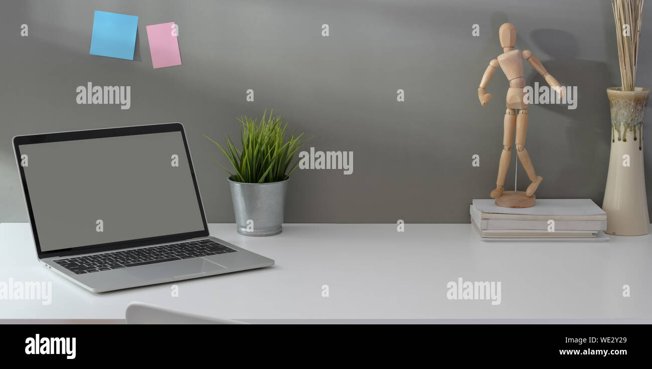 Open blank screen laptop computer with vintage camera and office ...