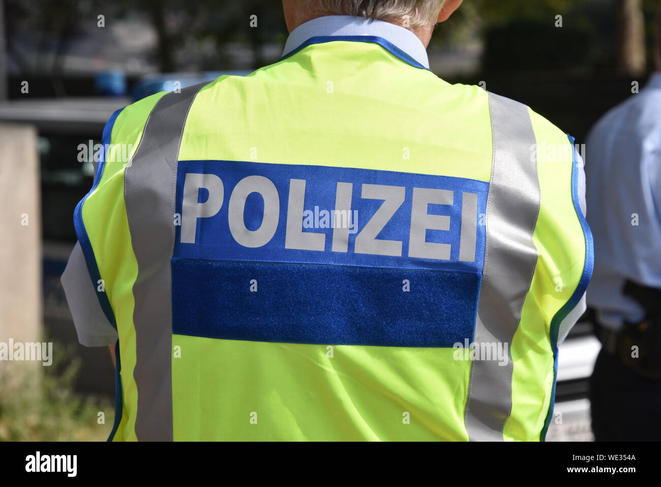 Cologne, Germany. 29th Aug, 2019. The words "Police" stand on the back ...
