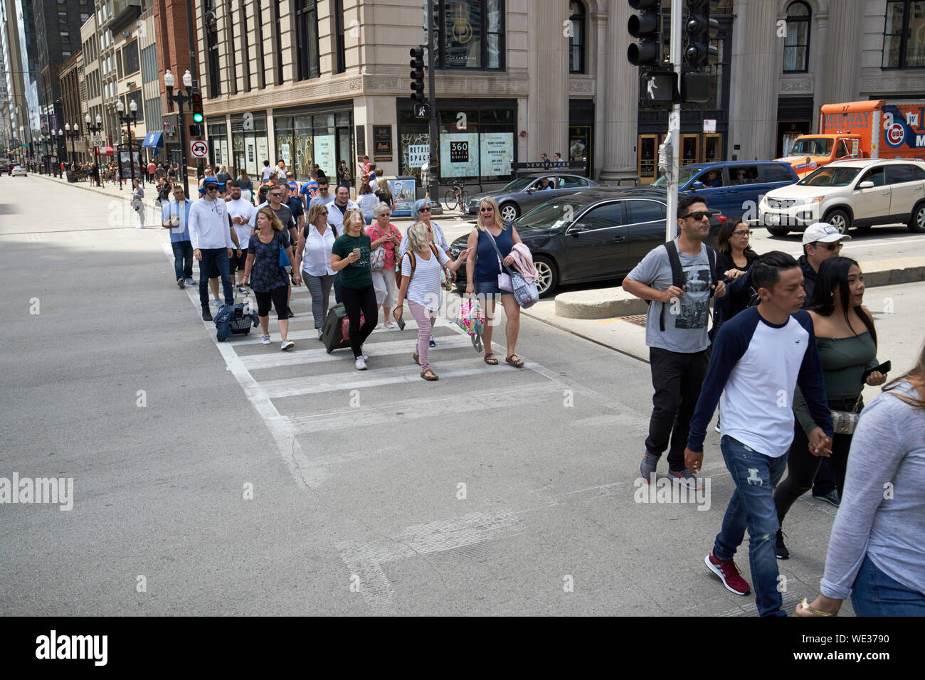 pedestrians cross crosswalk on michigan avenue chicago illinois united ...