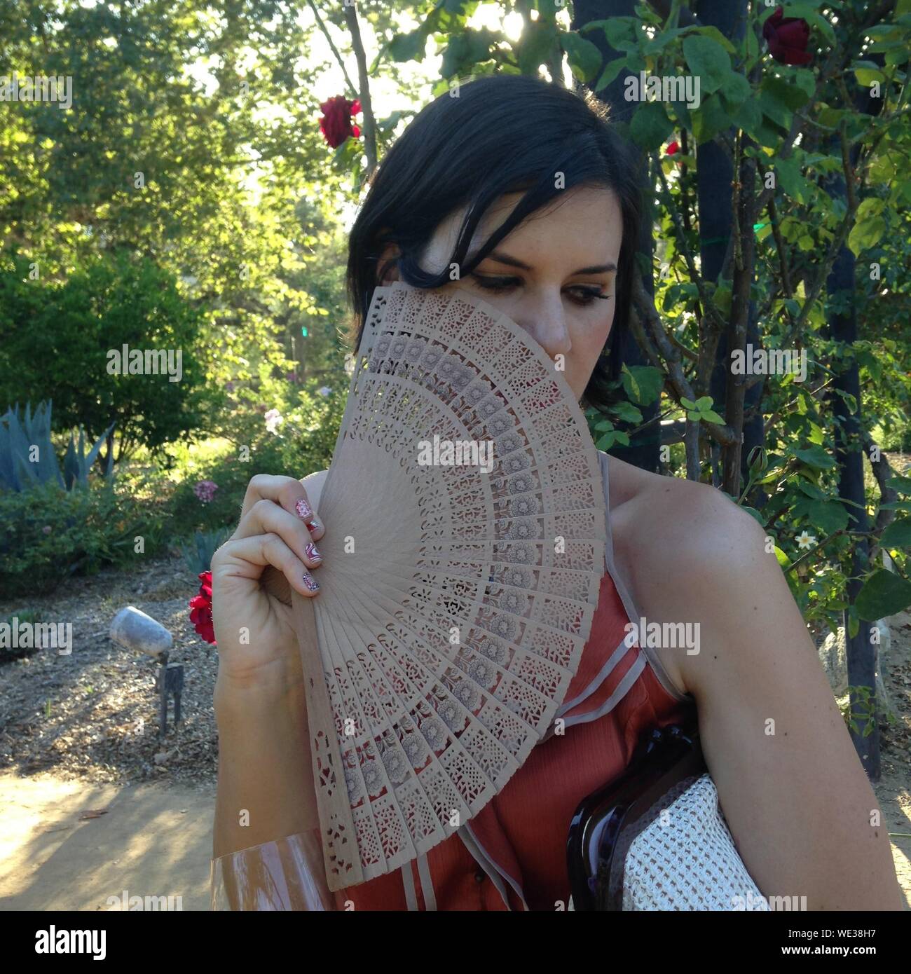 Indian hand holding fan indian hi-res stock photography and images - Alamy