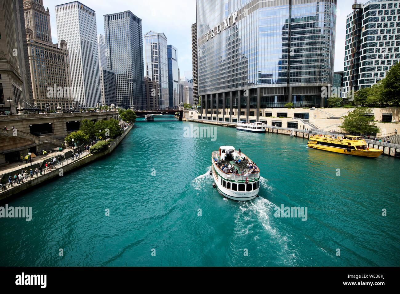 view of tour boat on the chicago river from the dusable bridge chicago ...