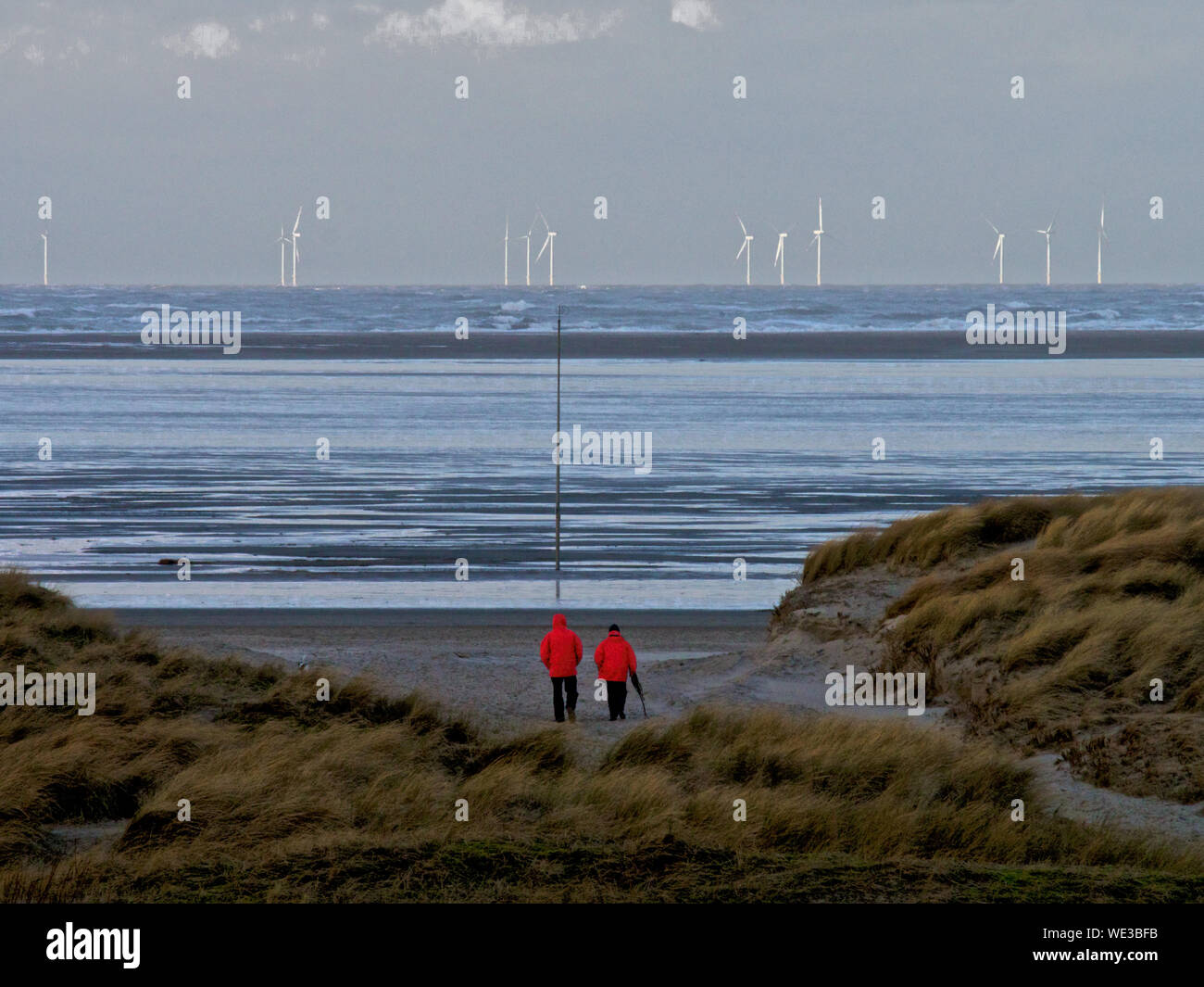 Standing against wind two people hi-res stock photography and images ...