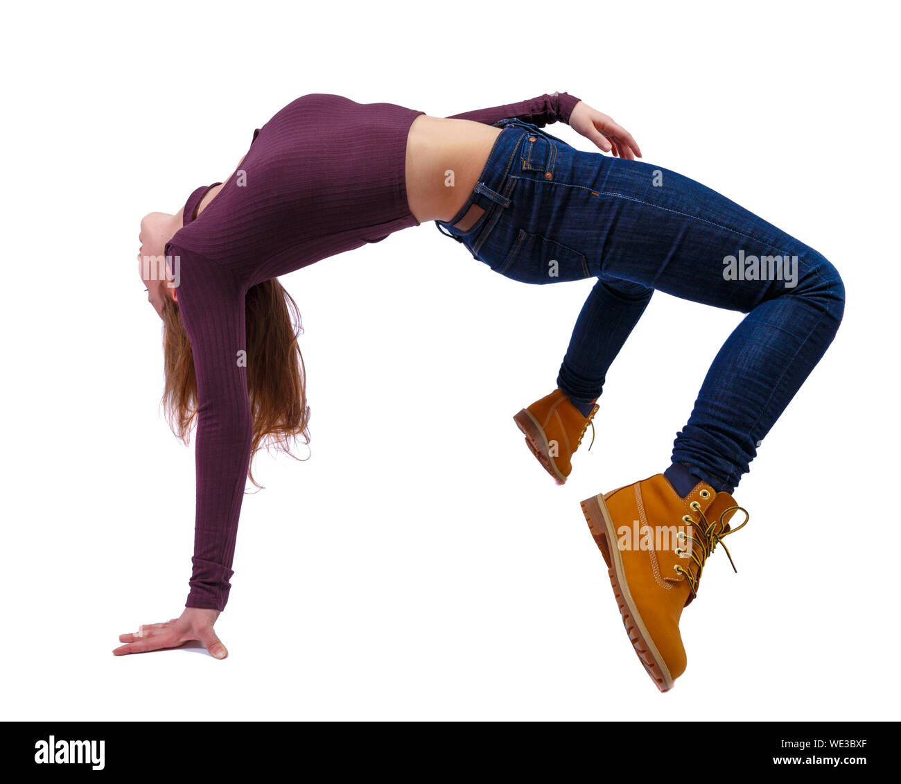 Side view of a woman dancing ballet. girl is balancing. Rear view ...