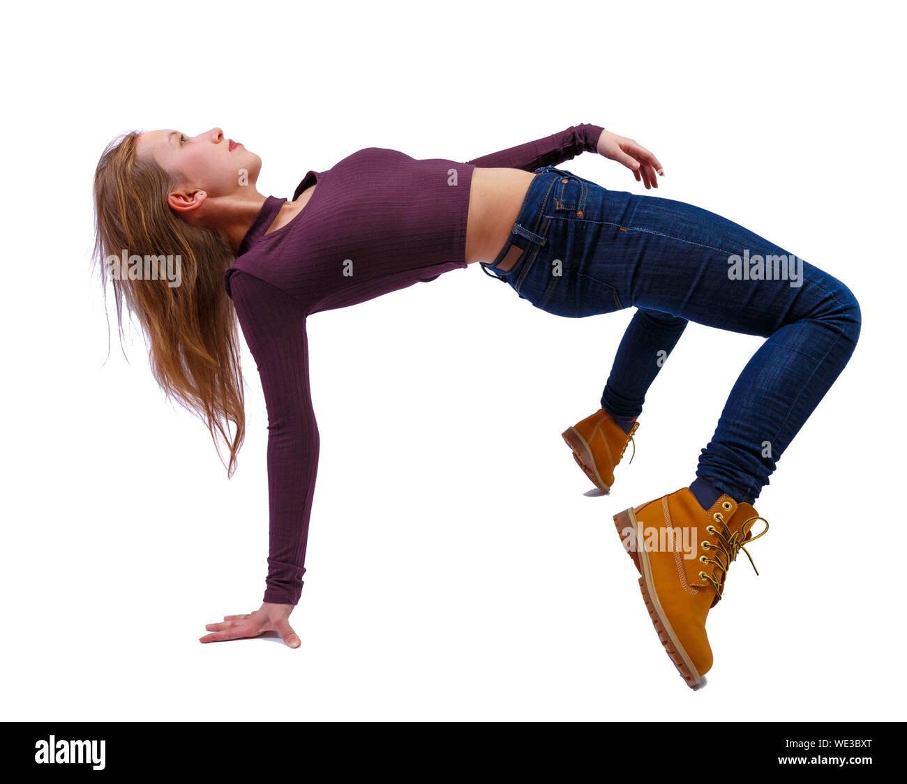 Side view of a woman dancing ballet. girl is balancing. Rear view ...