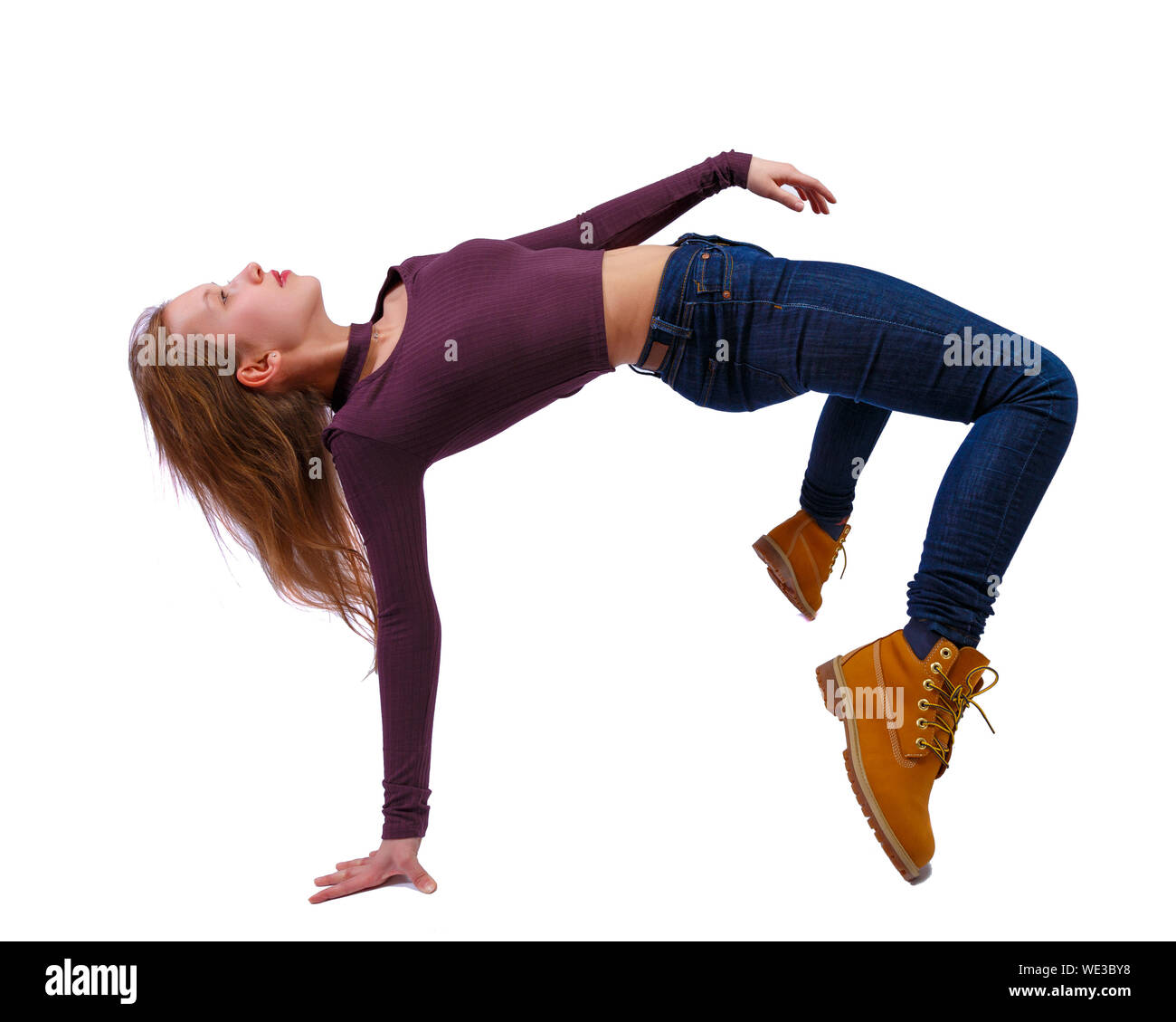 Side view of a woman dancing ballet. girl is balancing. Rear view ...