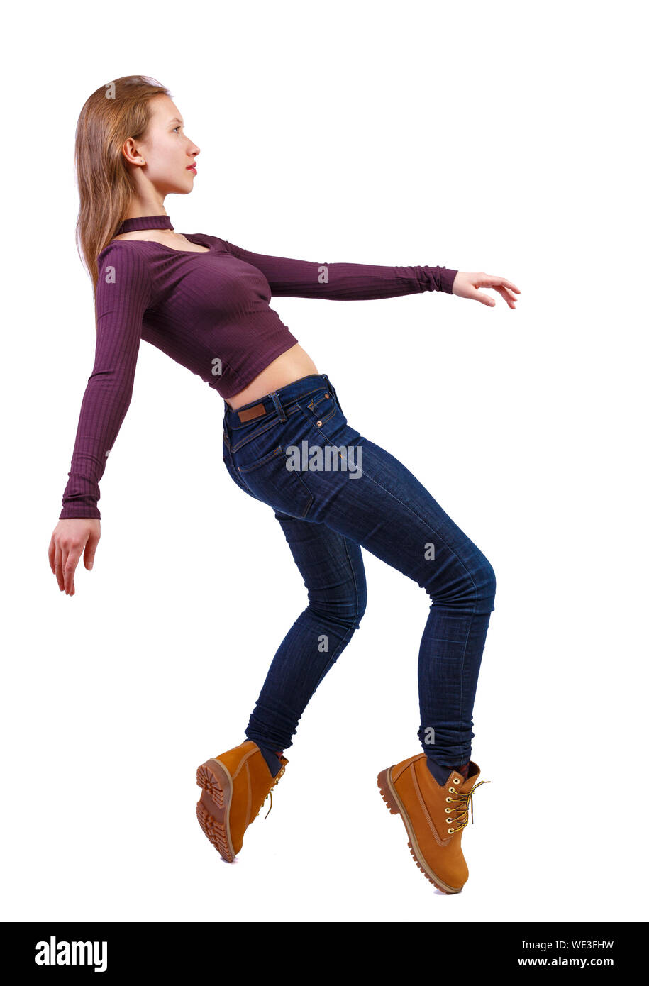 Side view of a woman dancing ballet. girl is balancing. Rear view ...