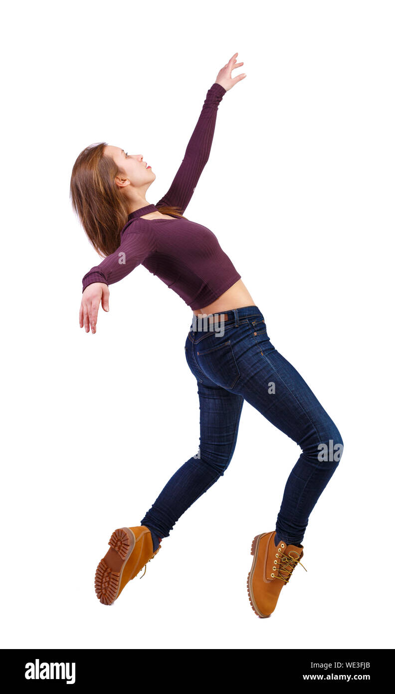 Side view of a woman dancing ballet. girl is balancing. Rear view ...