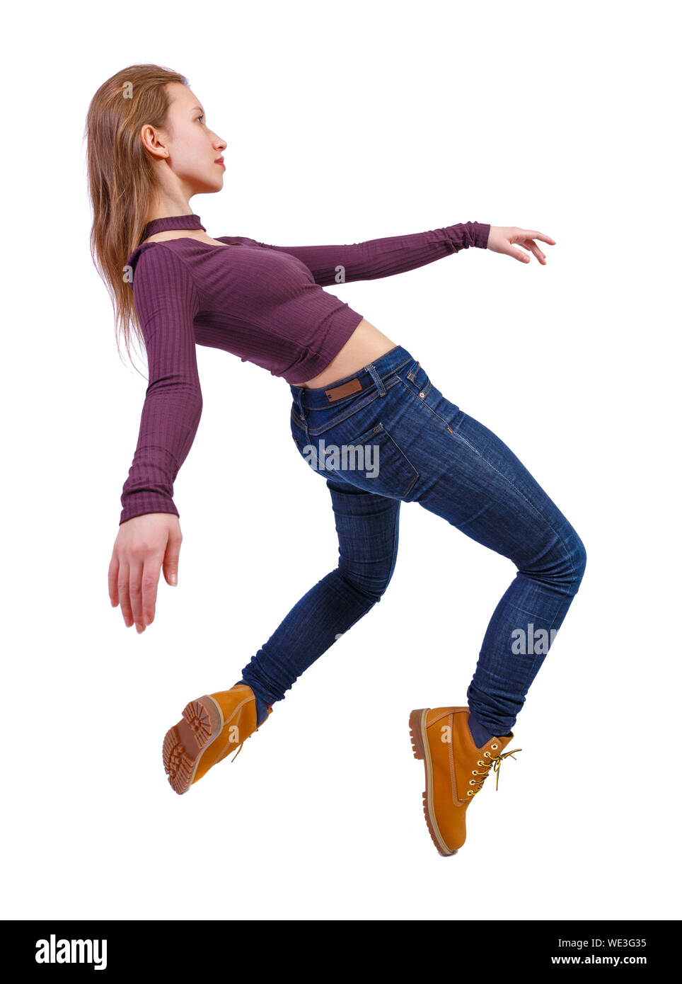 Side view of a woman dancing ballet. girl is balancing. Rear view ...