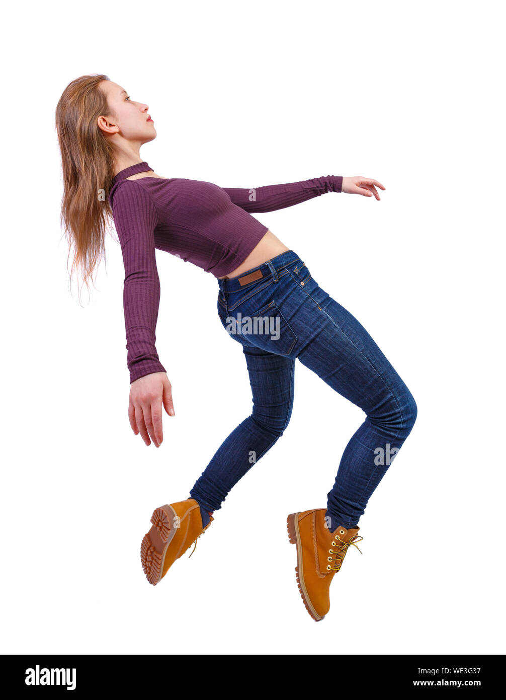 Side view of a woman dancing ballet. girl is balancing. Rear view ...