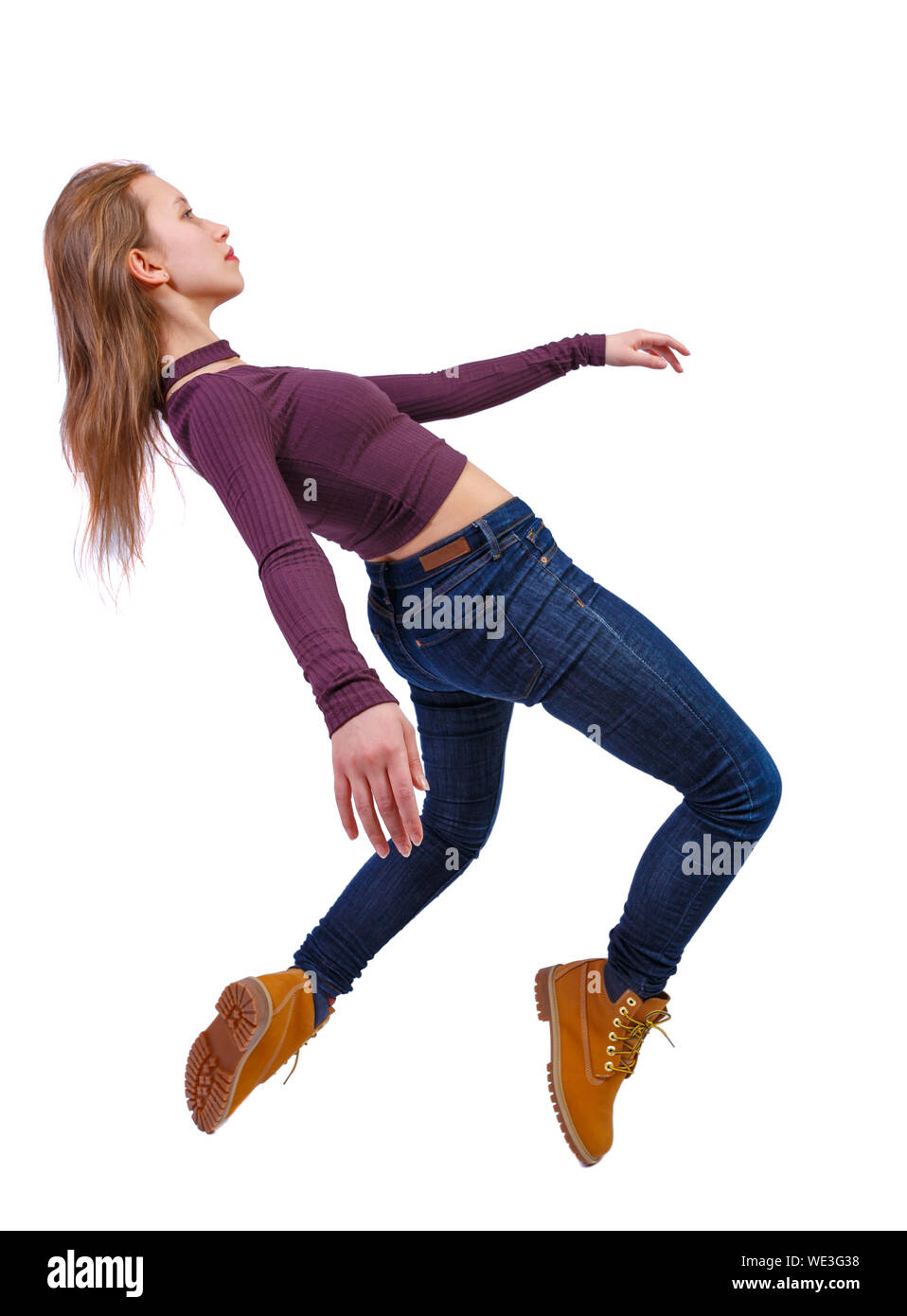 Side view of a woman dancing ballet. girl is balancing. Rear view ...
