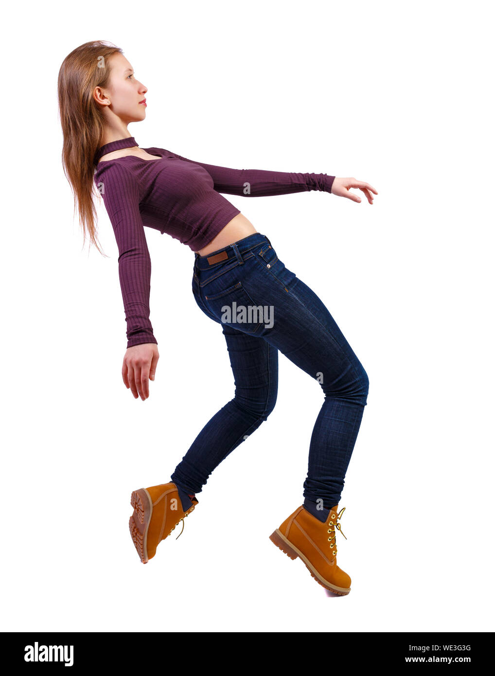 Side view of a woman dancing ballet. girl is balancing. Rear view ...