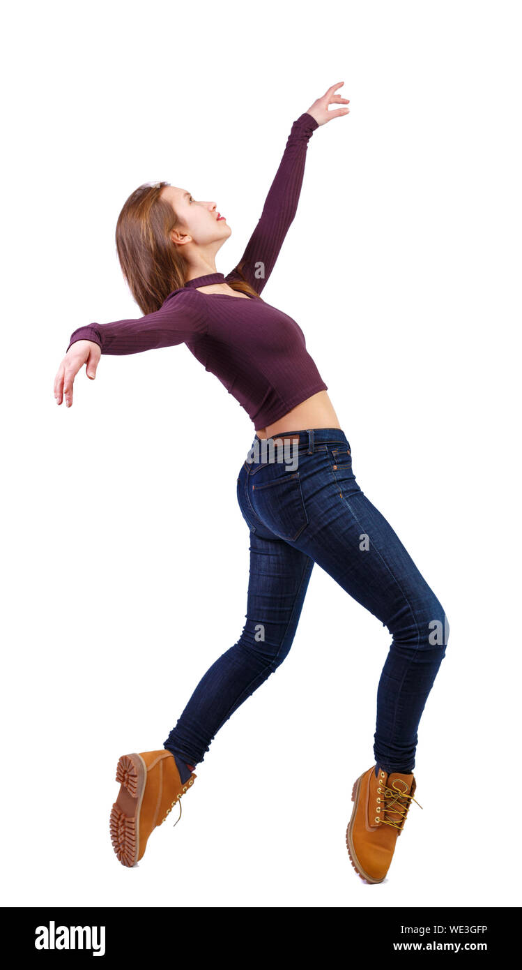 Side view of a woman dancing ballet. girl is balancing. Rear view ...