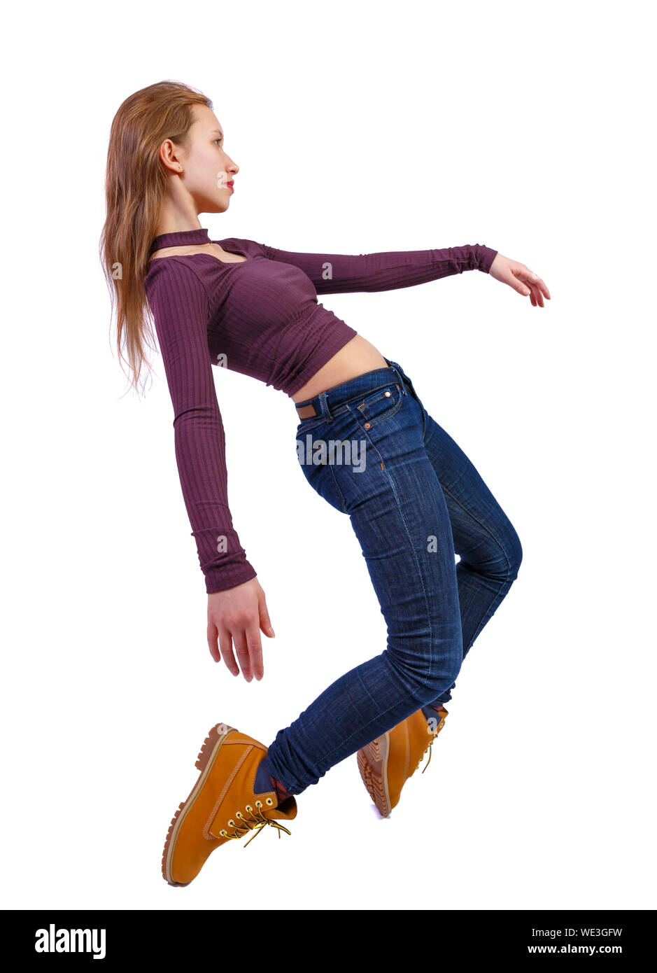 Side view of a woman dancing ballet. girl is balancing. Rear view ...