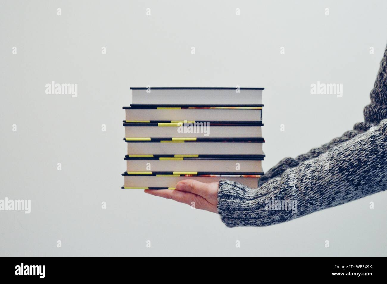 Person holding large book hi-res stock photography and images - Alamy