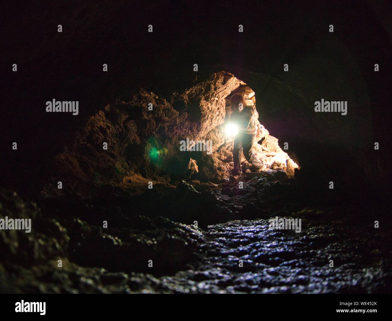 Flashlight in cave hi-res stock photography and images - Alamy