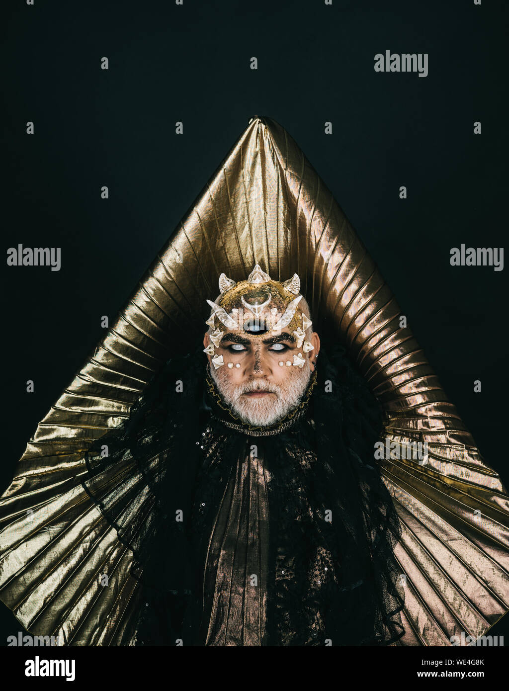 Wizard with tree blind eyes predicting future. Demon with golden collar ...