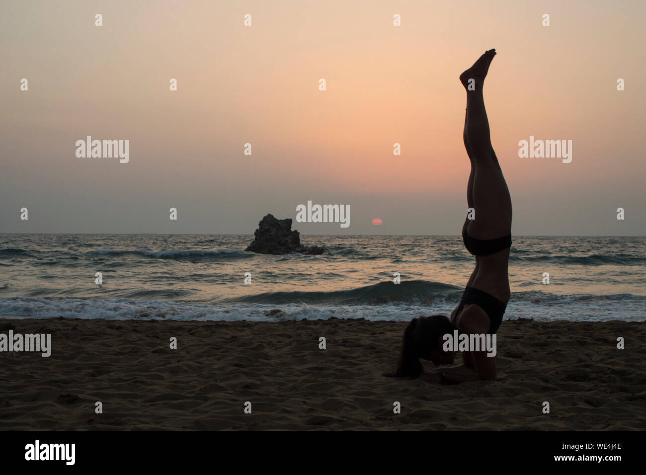 Woman handstand beach sand hi-res stock photography and images - Alamy