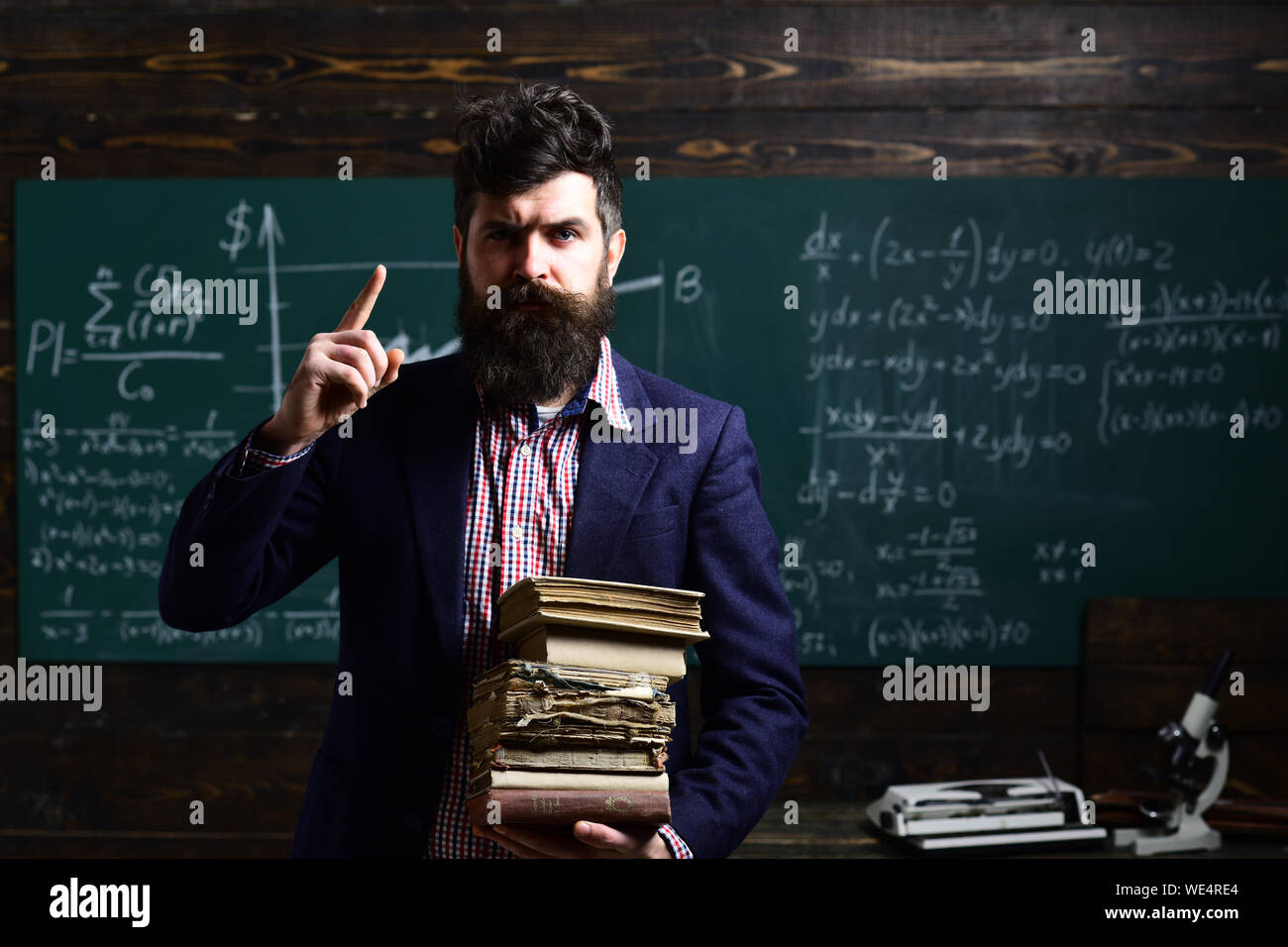 Good teachers help students ask great questions. Pretty teacher helping ...