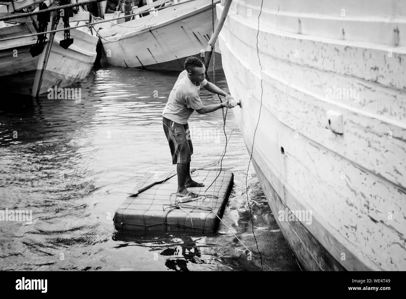 Man repairing boat Black and White Stock Photos & Images - Alamy