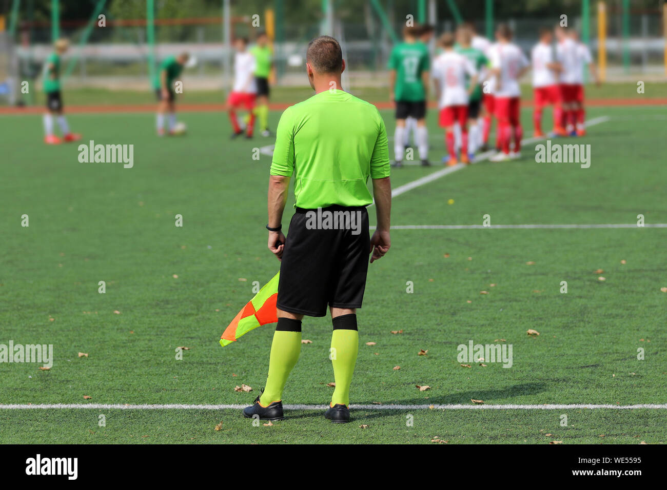 The line referee observes the situation on the football field Stock ...