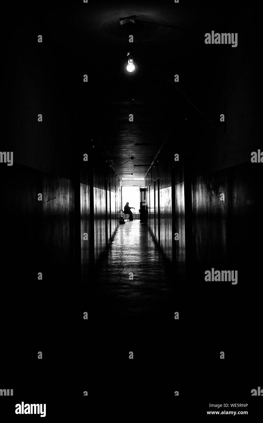 One woman indoors distant hi-res stock photography and images - Alamy