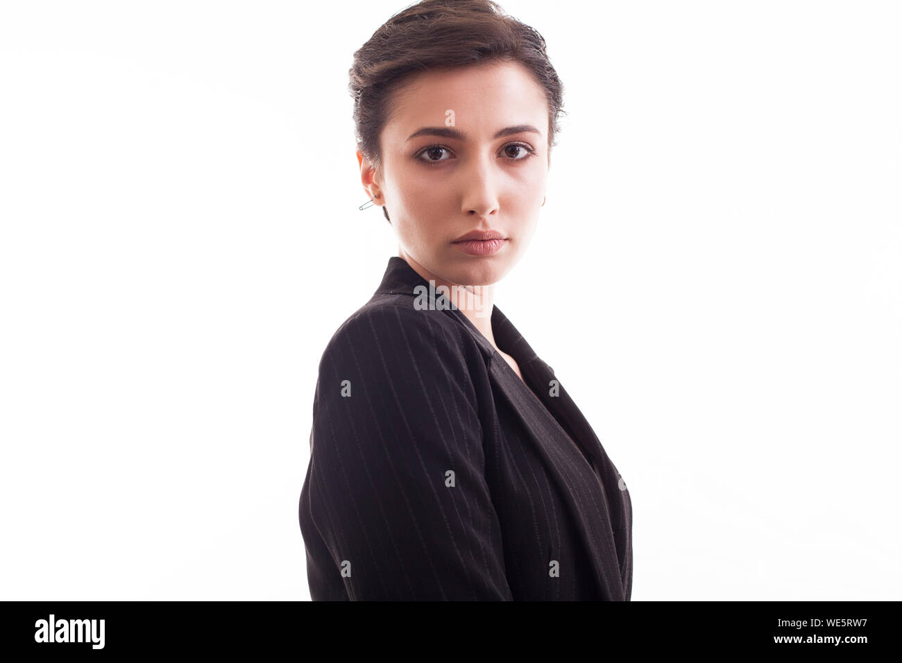 Side view portrait of beautiful young girl wearing a black jacket over ... Side view portrait of beautiful young girl wearing a black jacket over ...