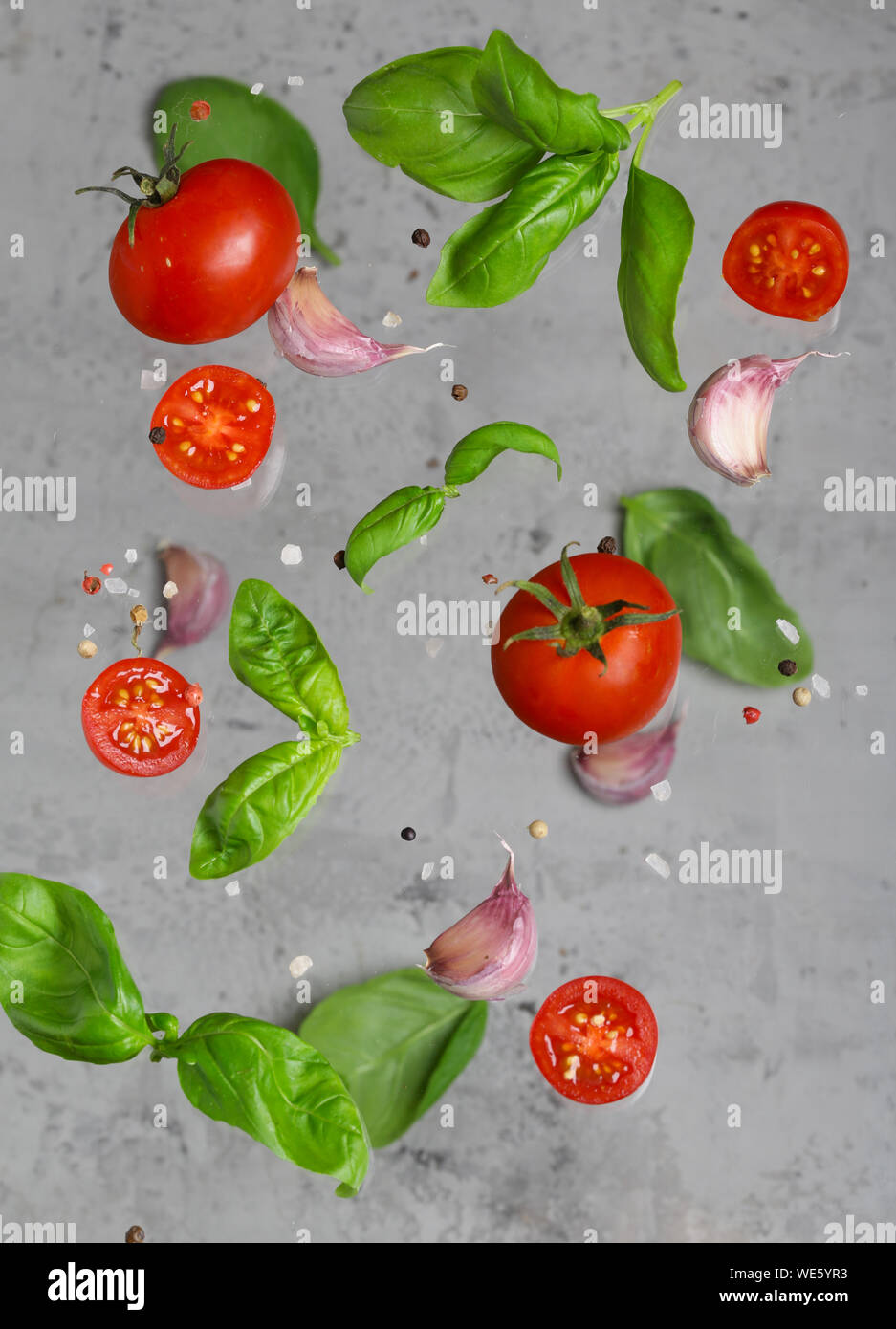 flying vegetables and herbs for salad Stock Photo - Alamy