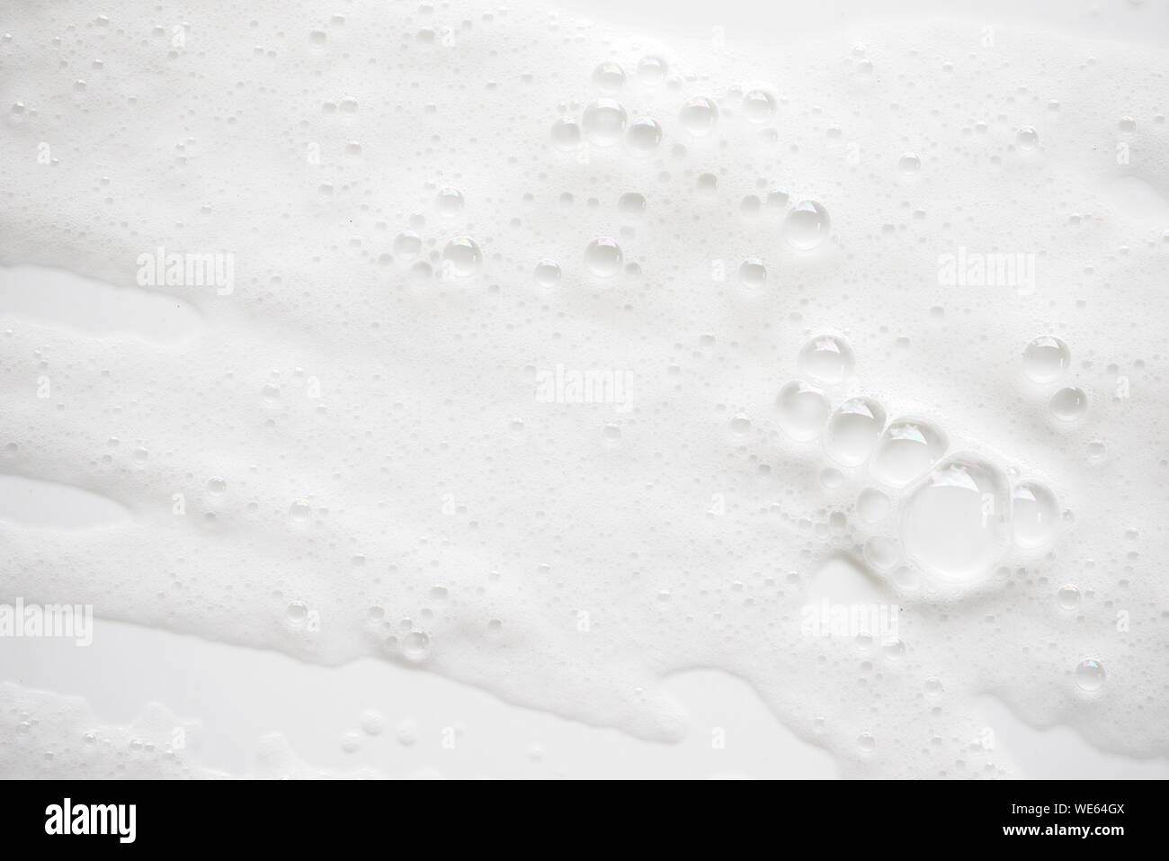 Abstract background white soapy foam texture. Shampoo foam with bubbles ...