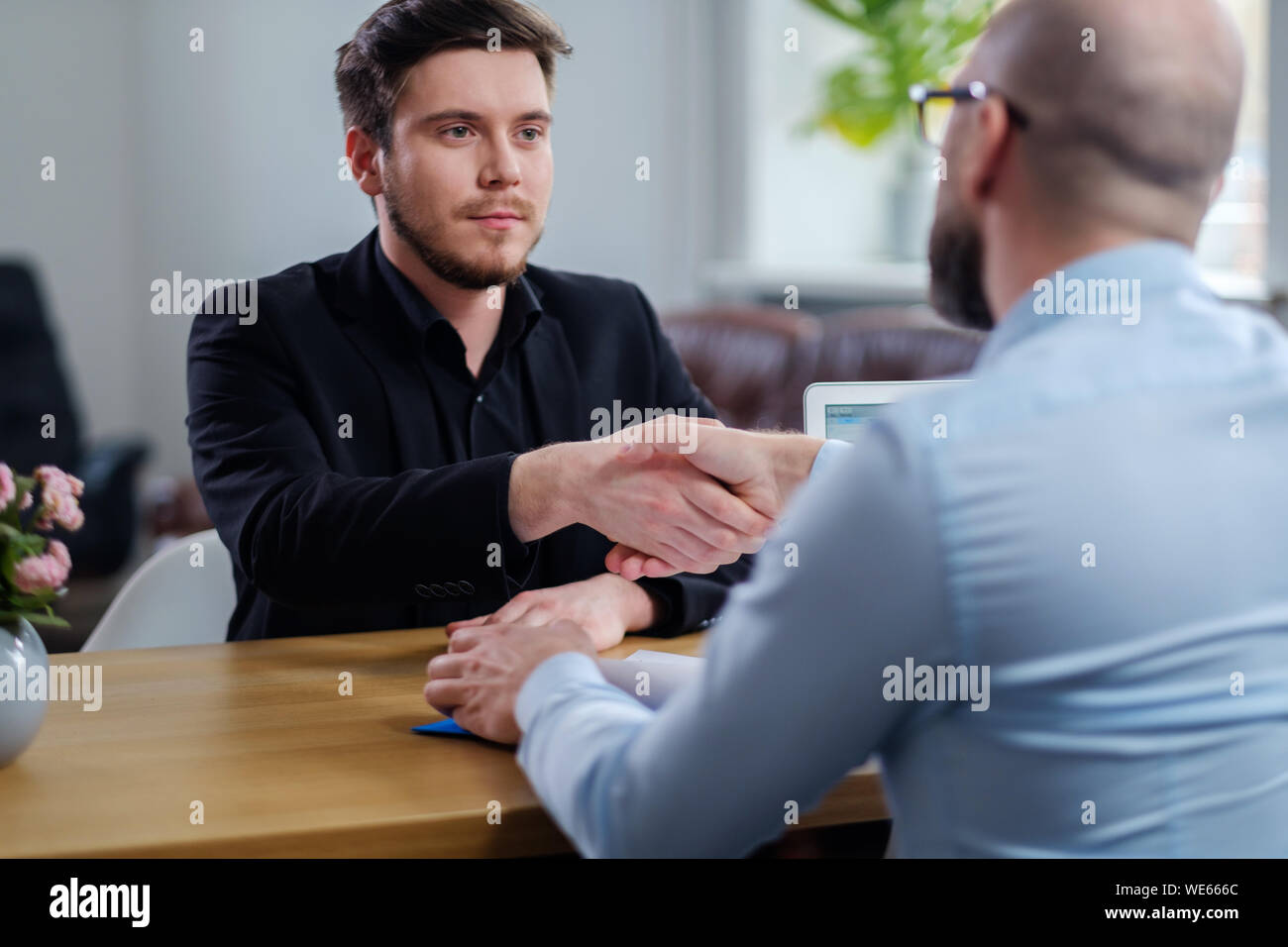 Confident young man attending job interview Stock Photo - Alamy