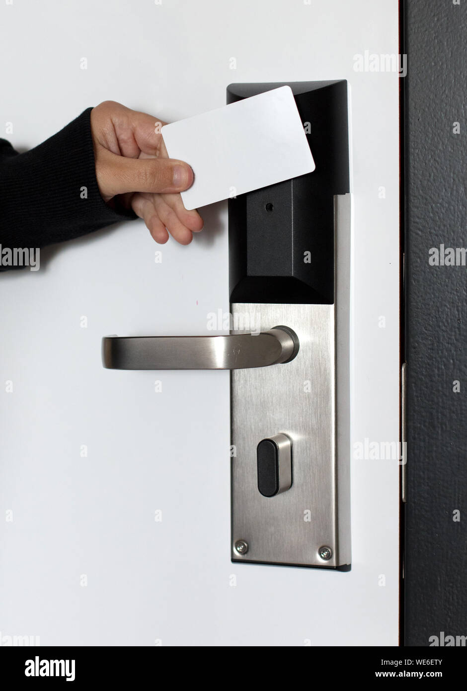 Hand using electronic smart contactless key card for unlock door in ...