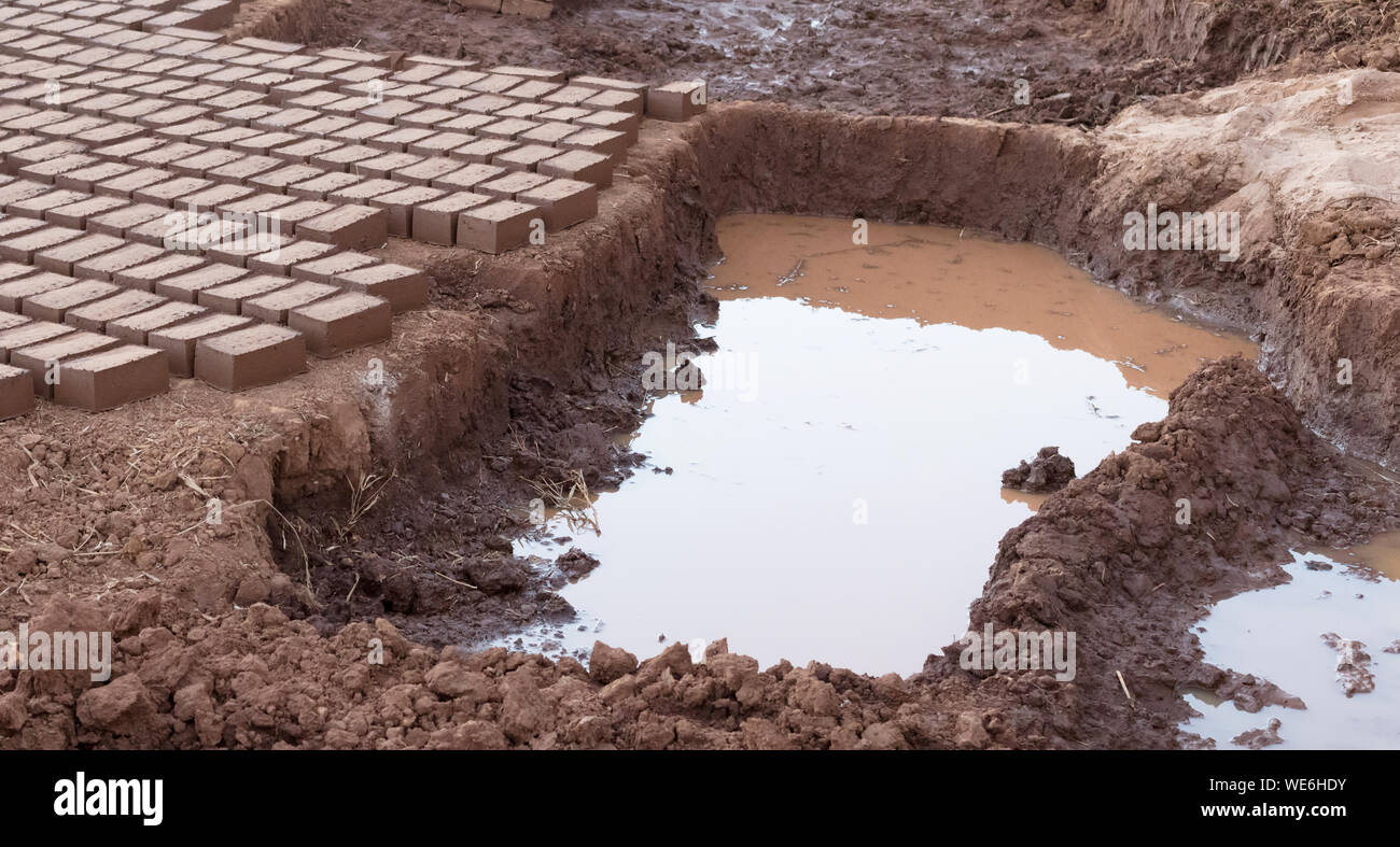 Mud bricks factory in Madagascar, drying bricks in the field Stock ...